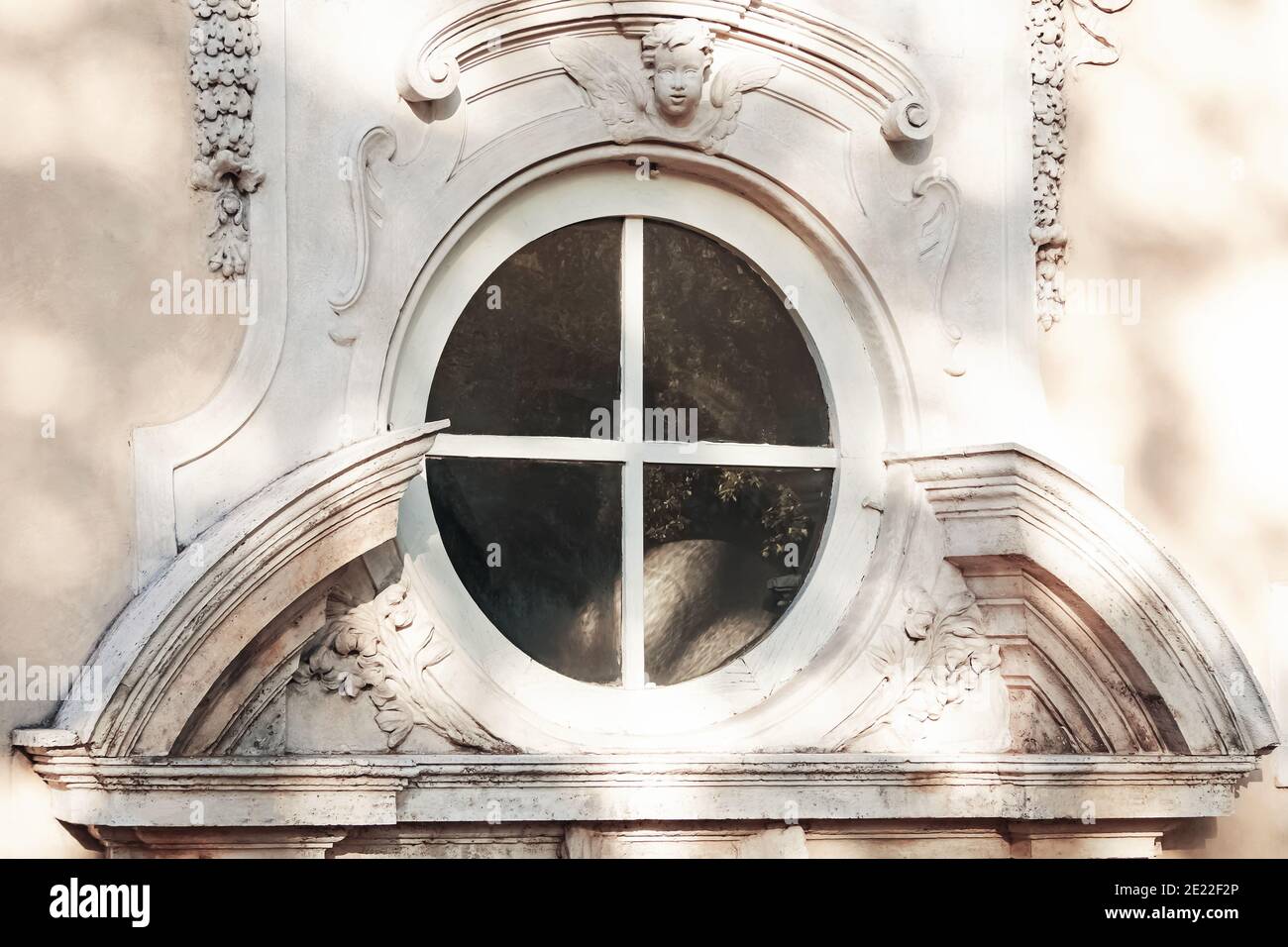 Round window decorated with stucco close up Stock Photo - Alamy