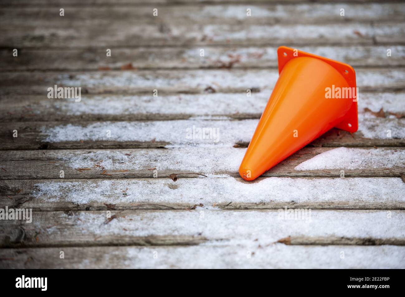 Shot of a small pylon laying on a deck Stock Photo - Alamy