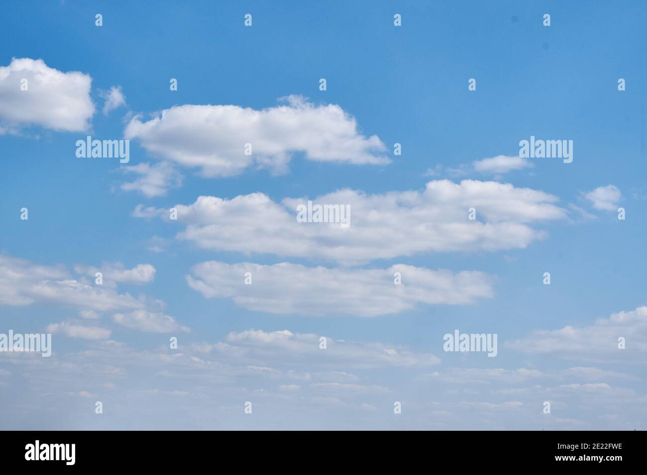 Background of cloudy blue sky. White clouds in clear spring weather ...