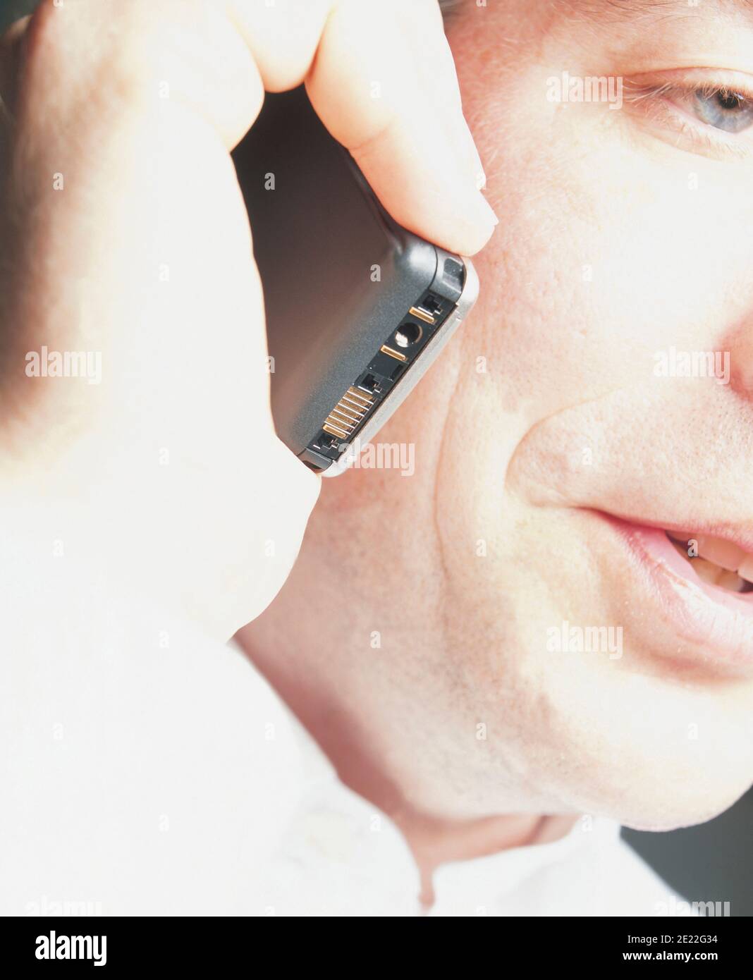 man speaking on old mobile cell phone Stock Photo - Alamy