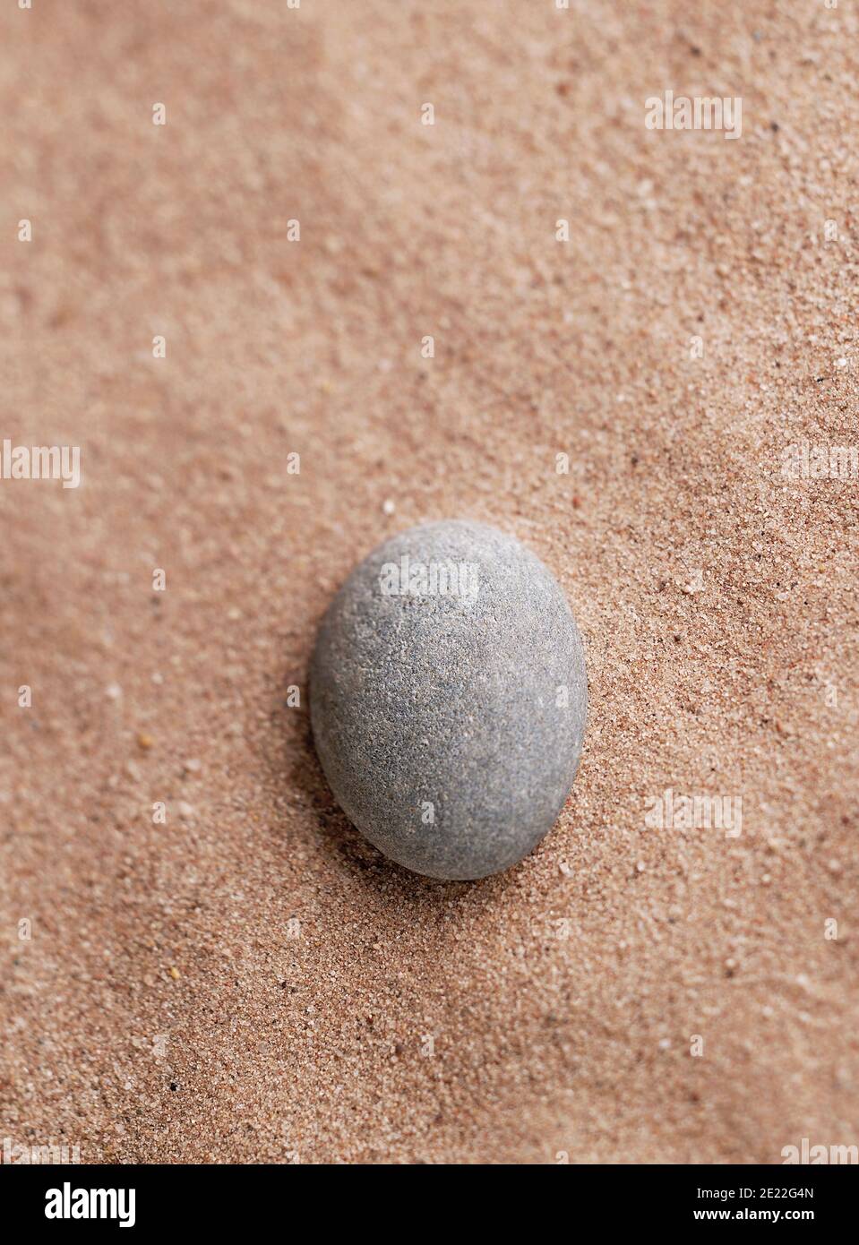 pebble on sand Stock Photo - Alamy