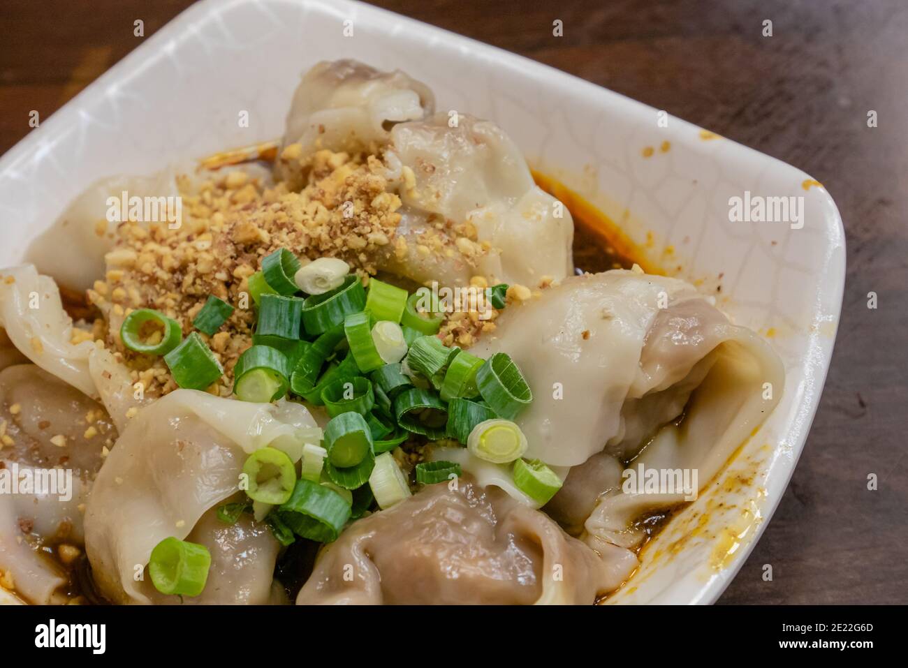 The close up of Taiwanese traditional steamed spicy stinky tofu wontons ...