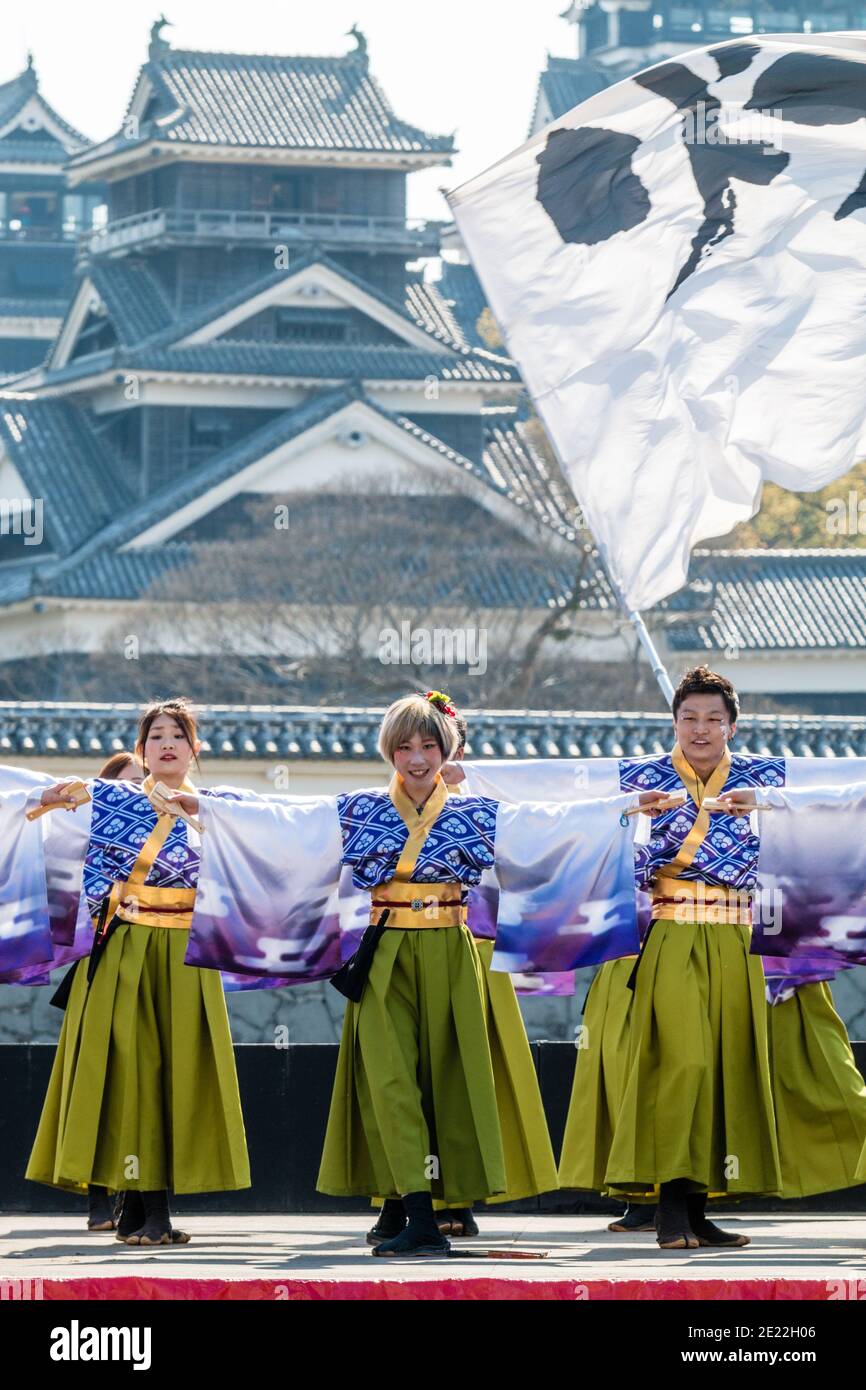 Japanese yosakoi dancers on stage dancing facing viewer, eye contact ...