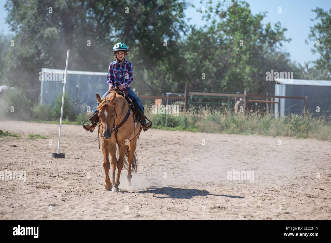 Tween girl warming up horse before rodeo events Stock Photo - Alamy
