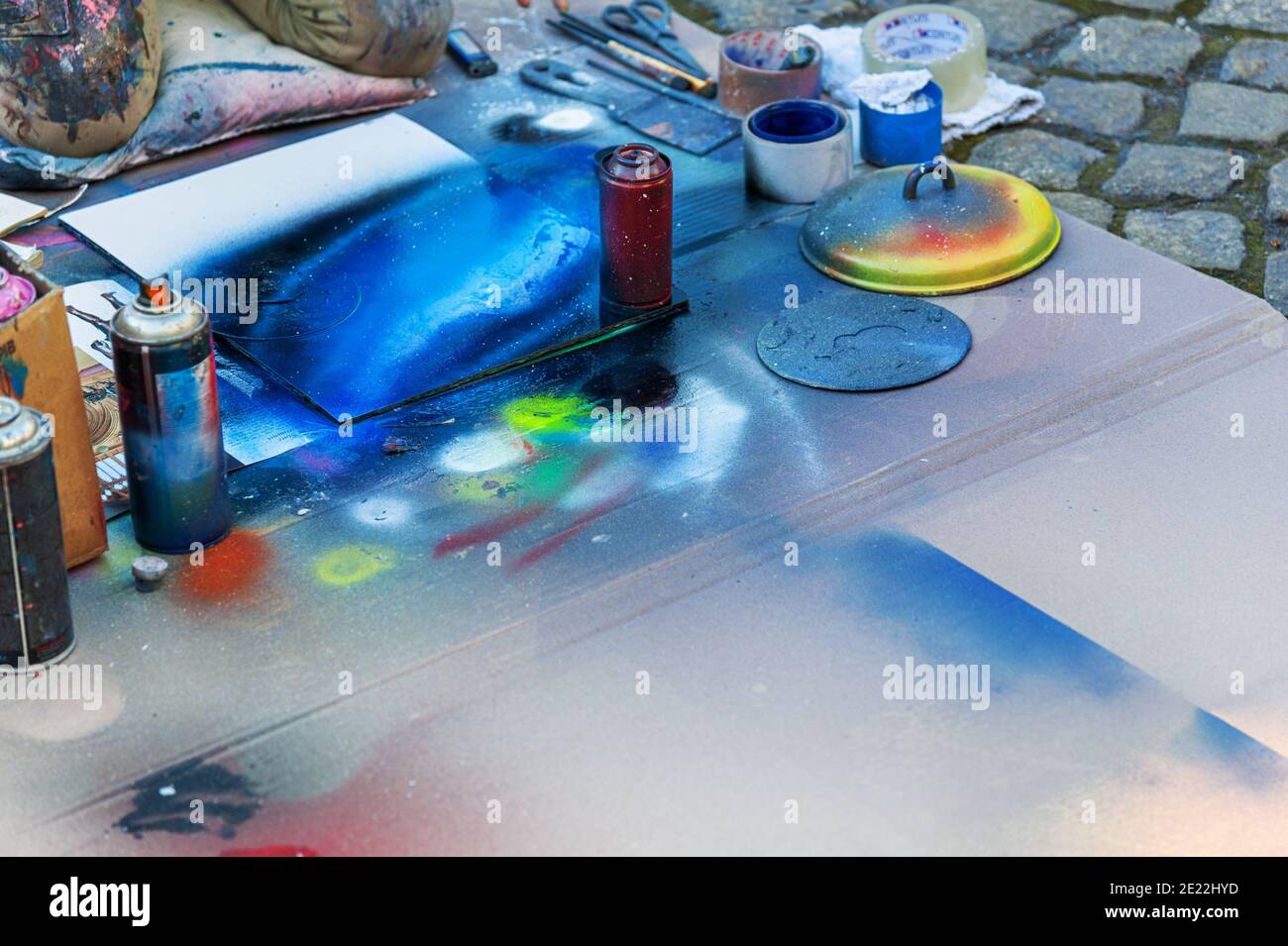 Used aerosol spray paint in cans in carton Stock Photo - Alamy