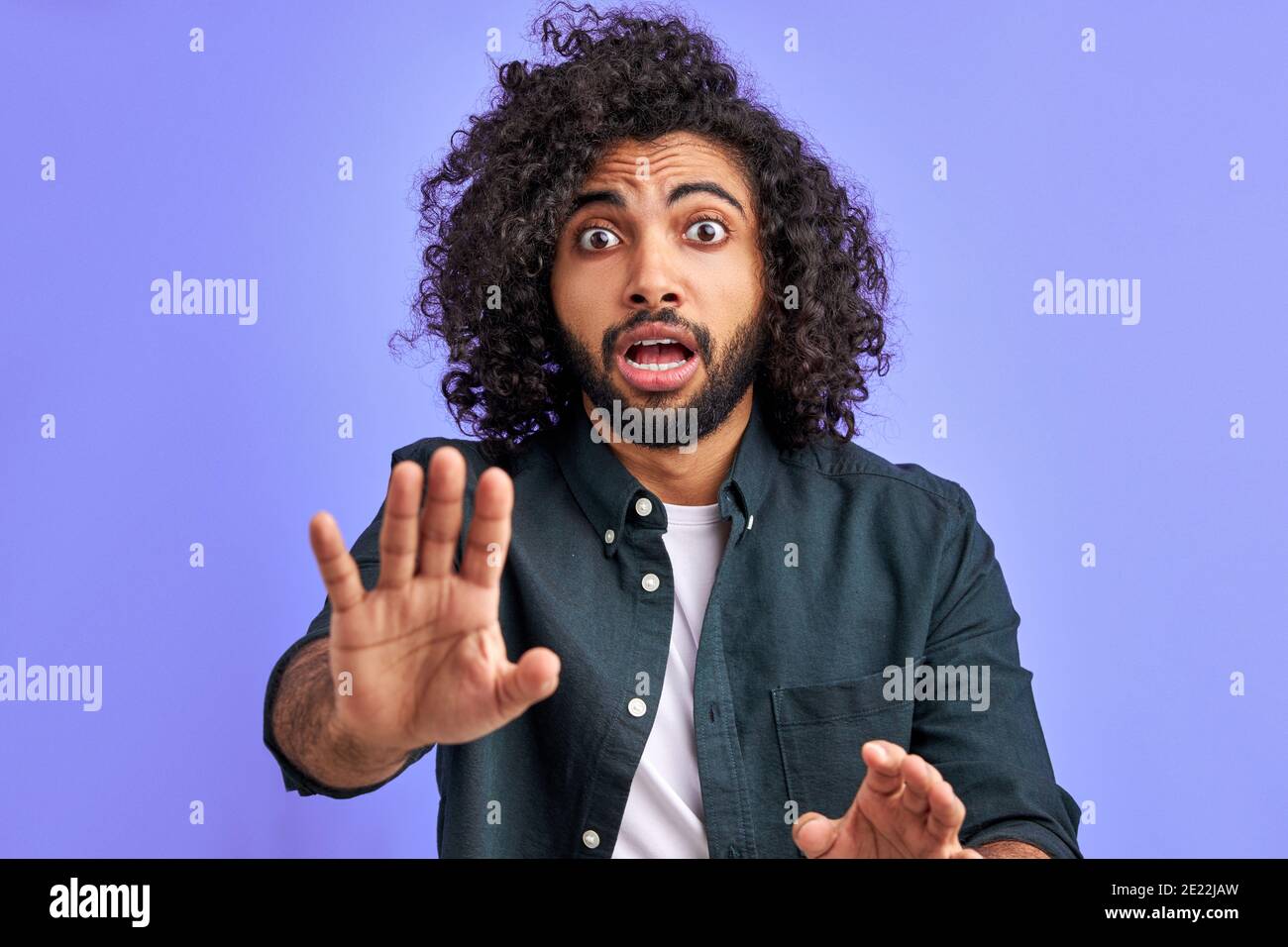 alarming scared panicking man is gesturing stop, afraid of something ...