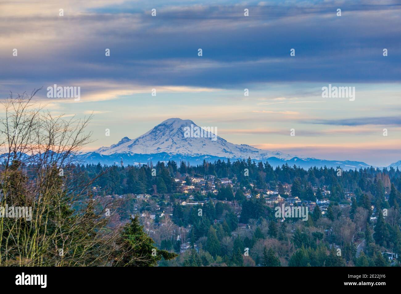 A view of Mount Rainier with clouds above Stock Photo - Alamy