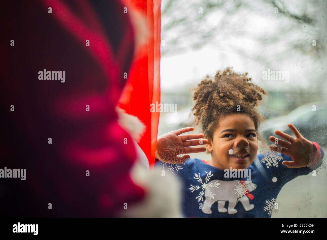 Seeing Santa in the window Stock Photo - Alamy