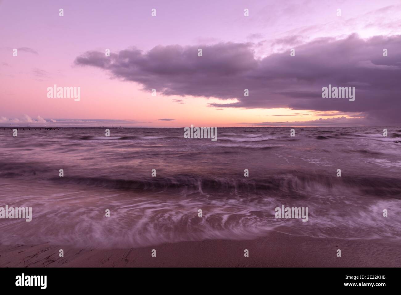 Beautiful seascape at purple sunset in the evening Stock Photo - Alamy