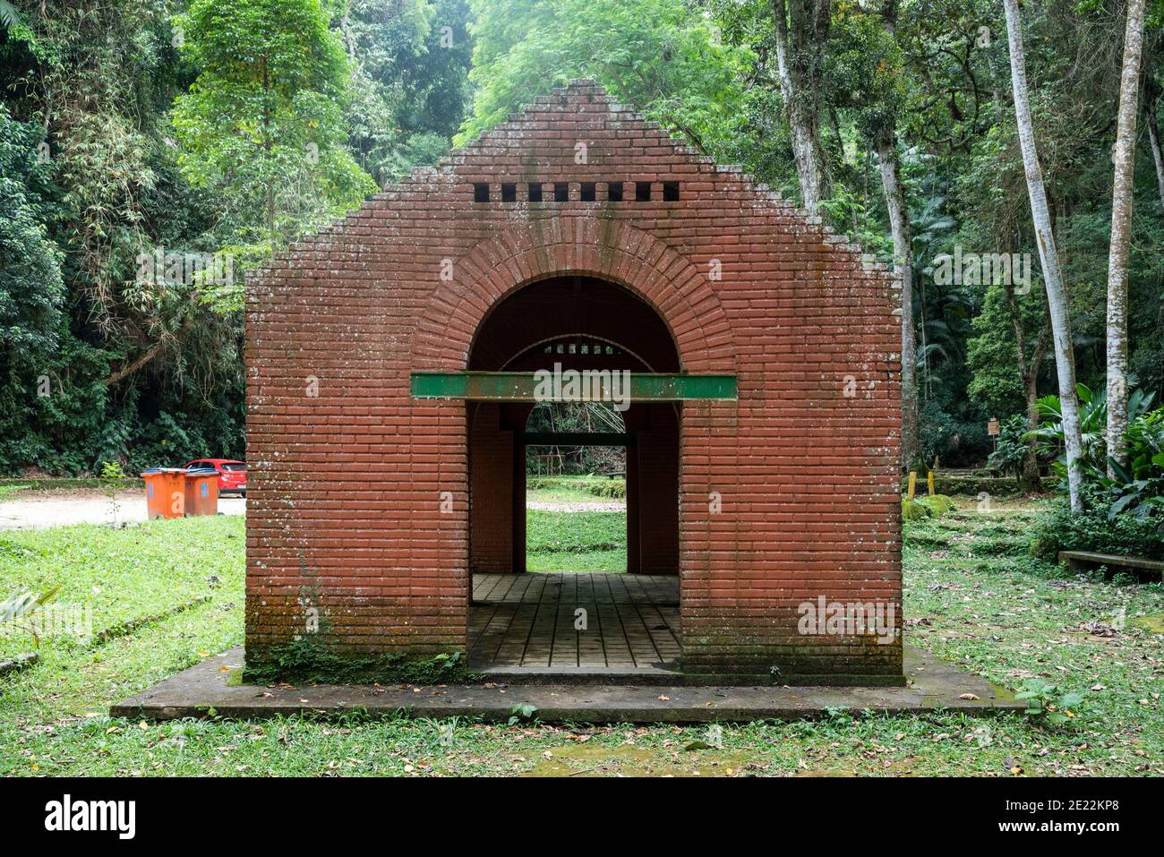 Red brick rustic building on green atlantic rainforest area in Tijuca ...