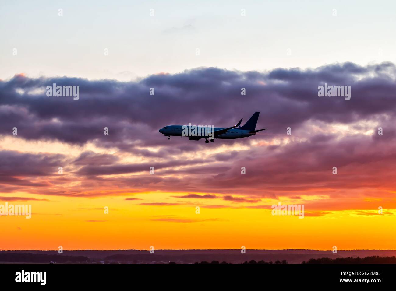 Early morning passenger airliner landing against the background of a ...