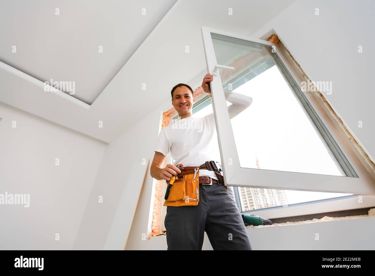 male industrial builder worker at window installation in building ...