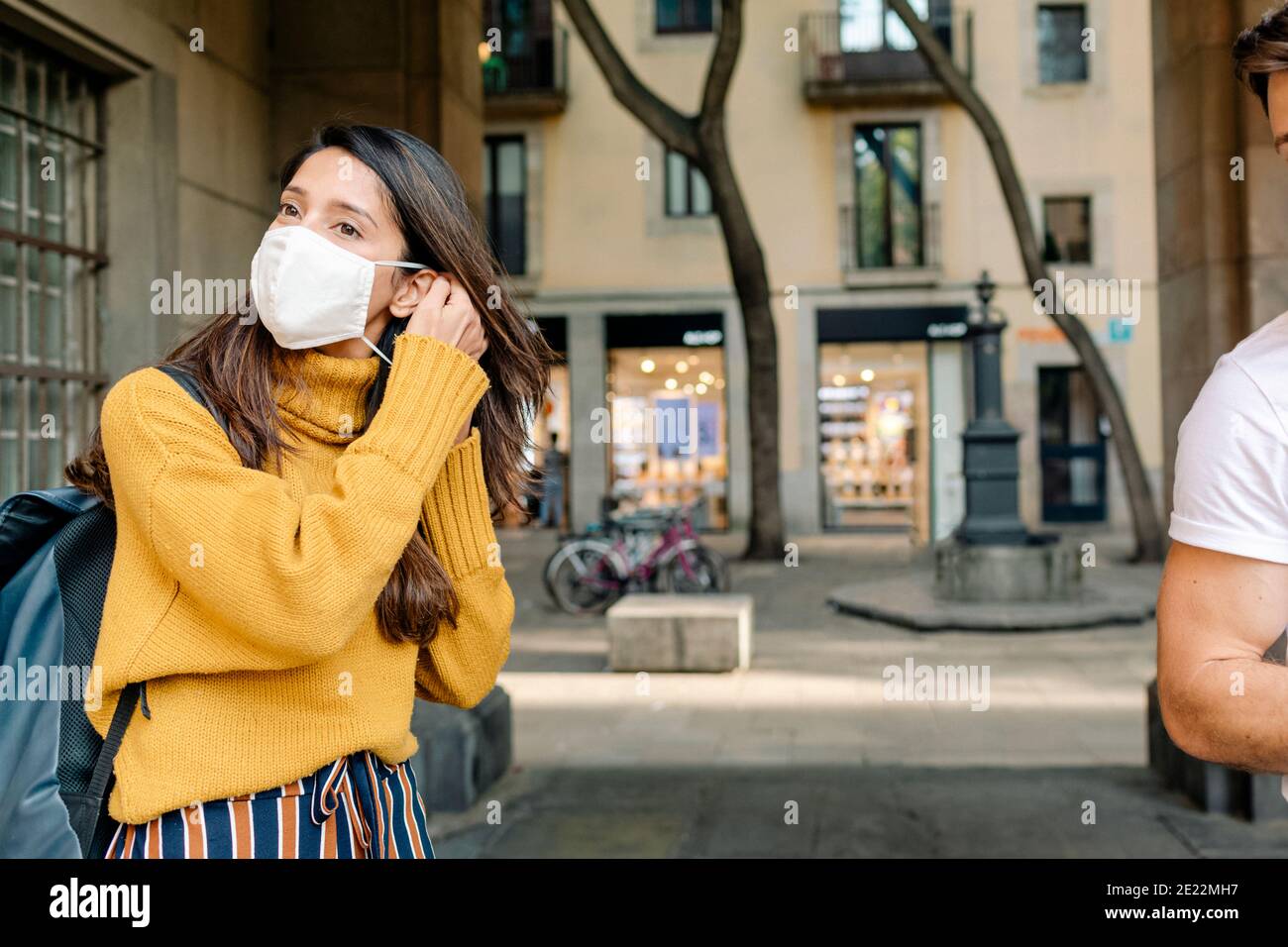Woman putting on a mask hi-res stock photography and images - Alamy