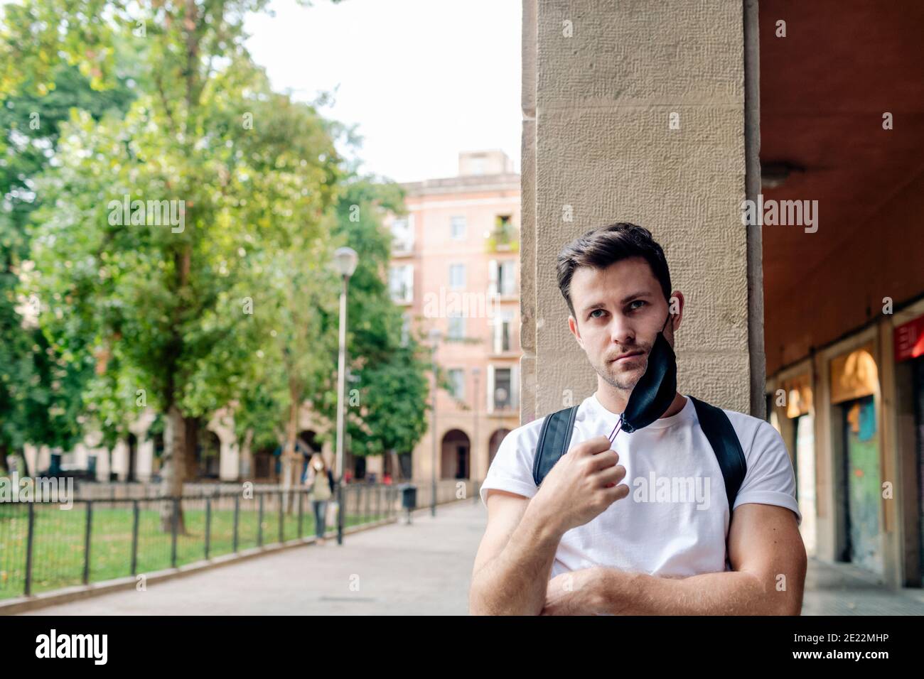 Removing a mask hi-res stock photography and images - Alamy