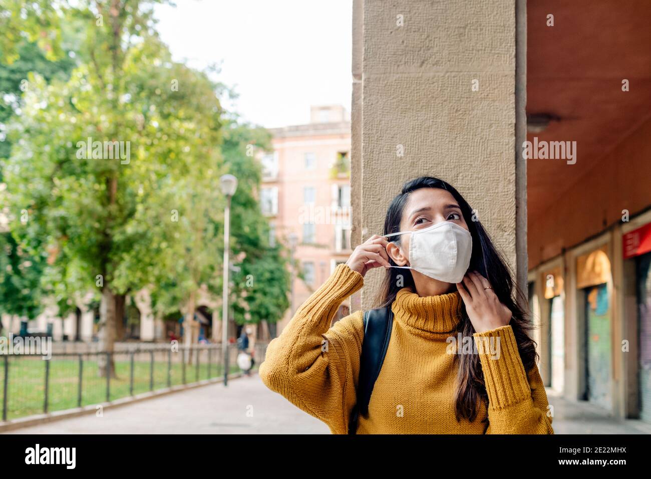 Woman putting on a mask hi-res stock photography and images - Alamy