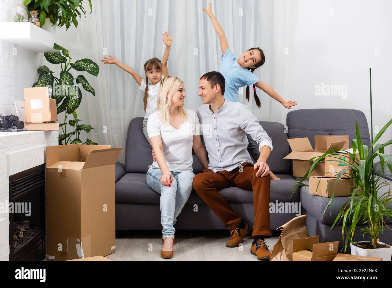 Portrait of a happy family smiling at home Stock Photo - Alamy