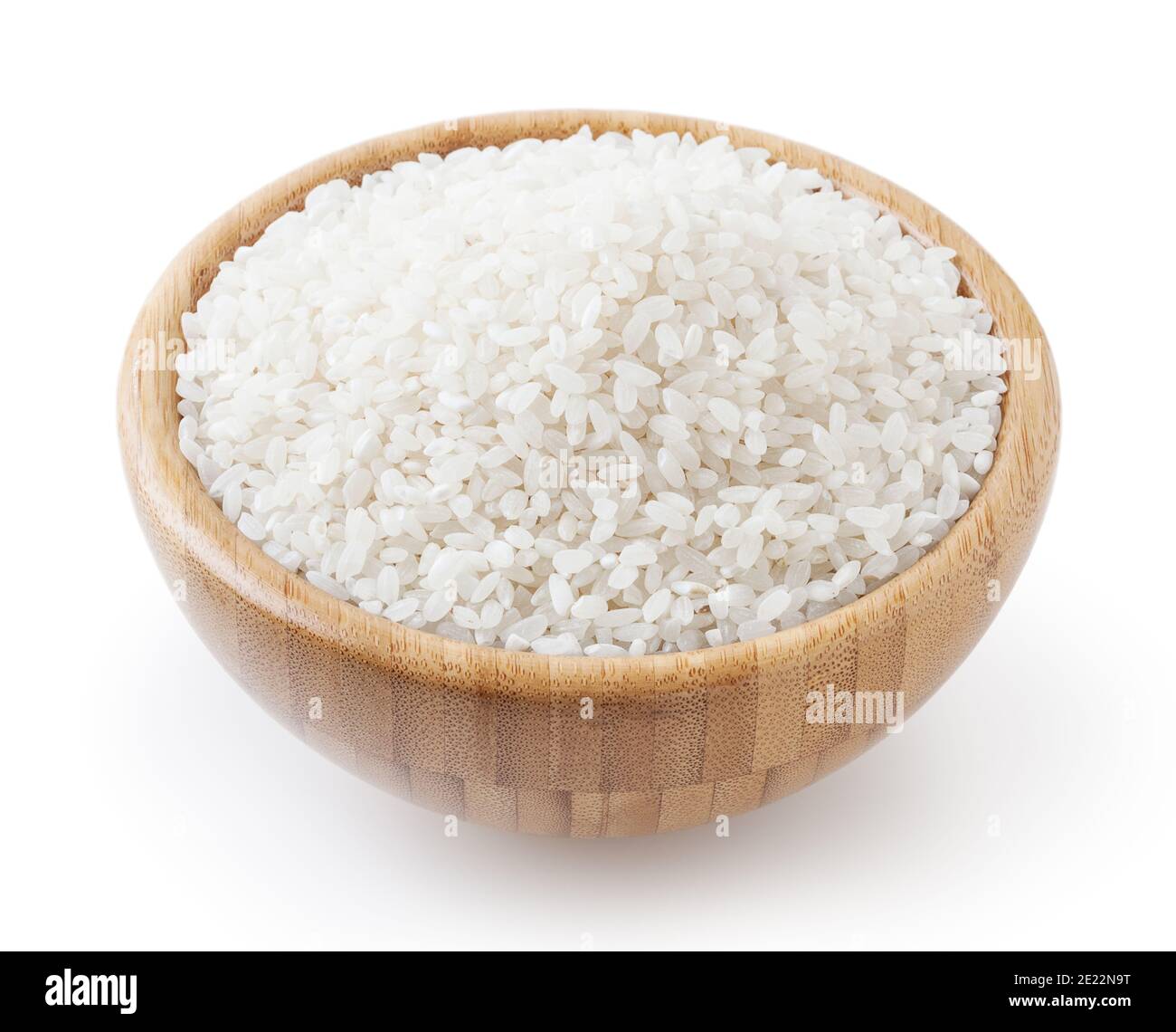 Uncooked round rice in wooden bowl isolated on white background with ...