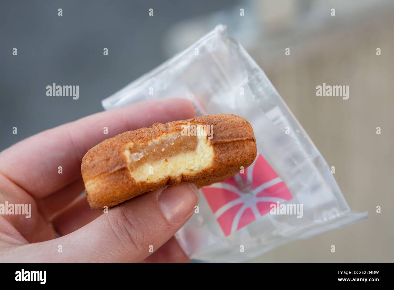 Momiji manjū, maple leaf shaped cake, with a bite taken out showing the ...
