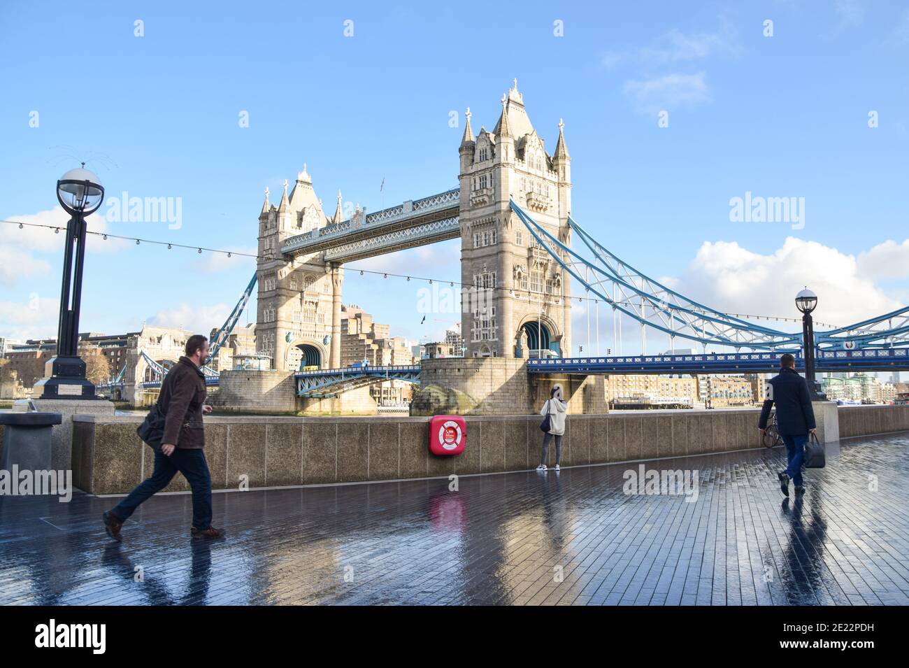 People walking past Tower Bridge in London, daytime view Stock Photo ...