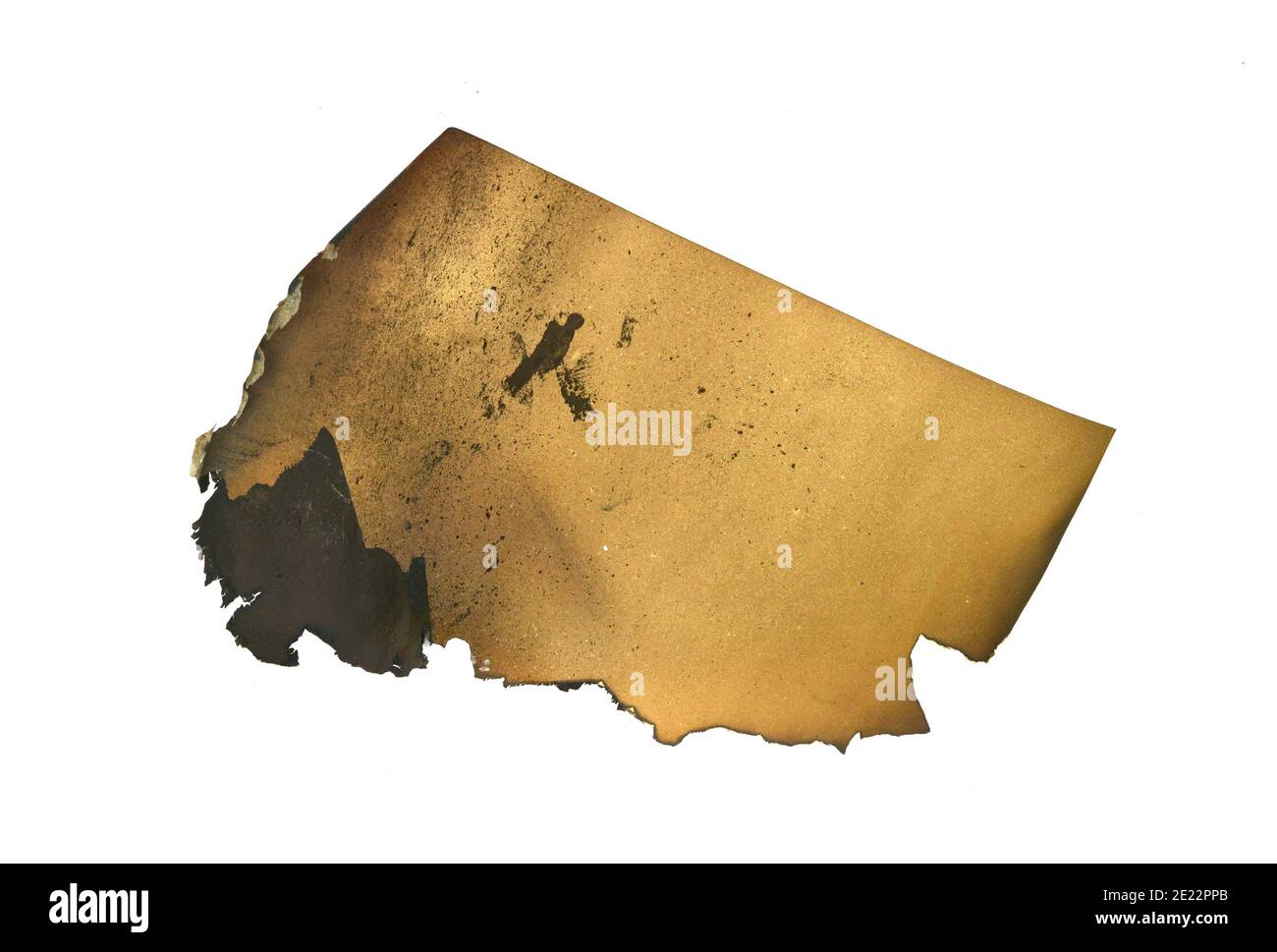 Pieces of burnt paper on a white background. The ashes of the paper ...