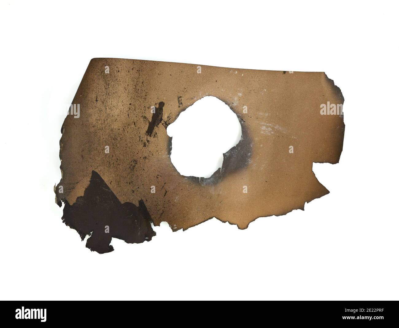 Pieces of burnt paper on a white background. The ashes of the paper ...