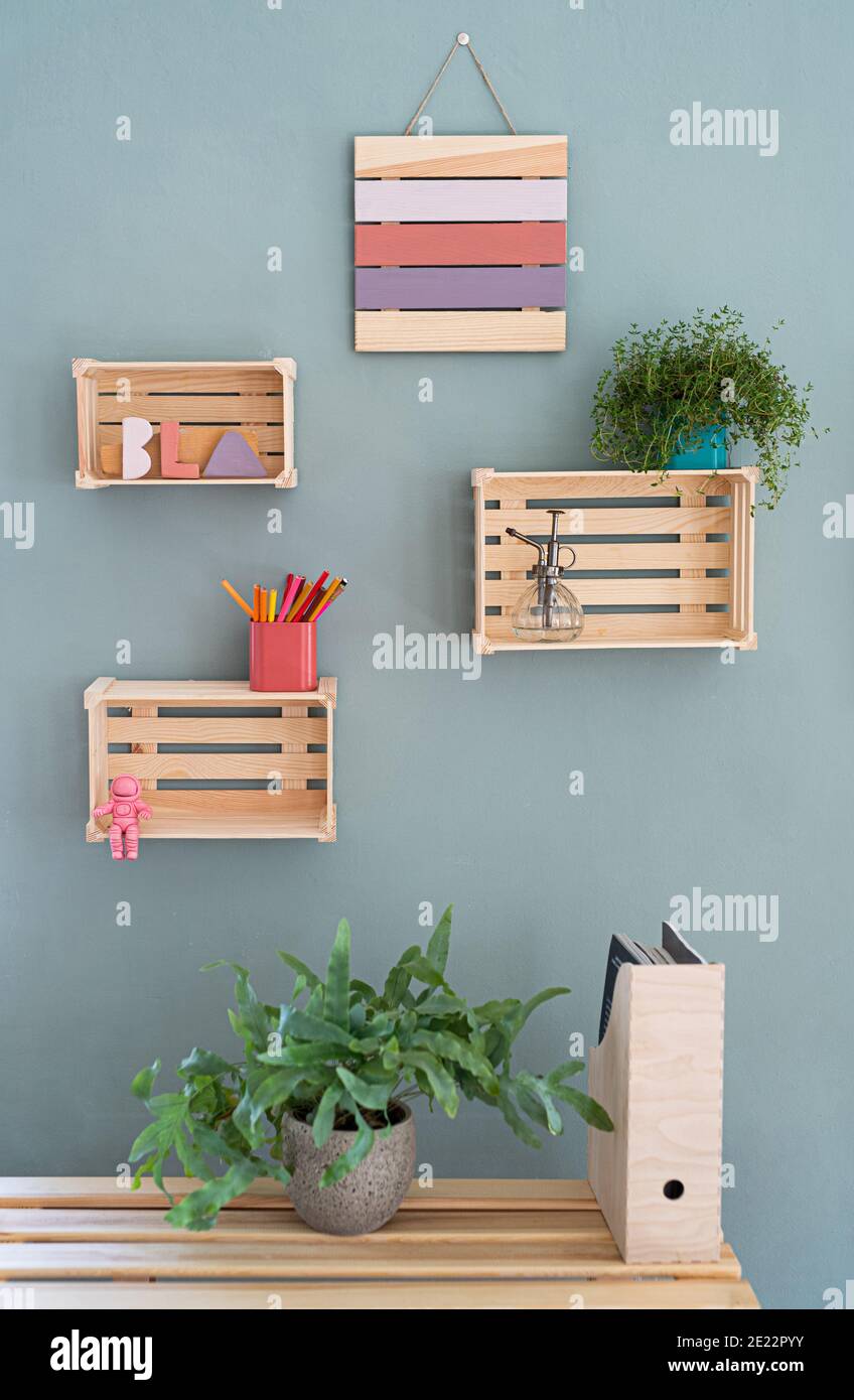 Wooden box shelves with decorations on the wall, natural decor concept ...
