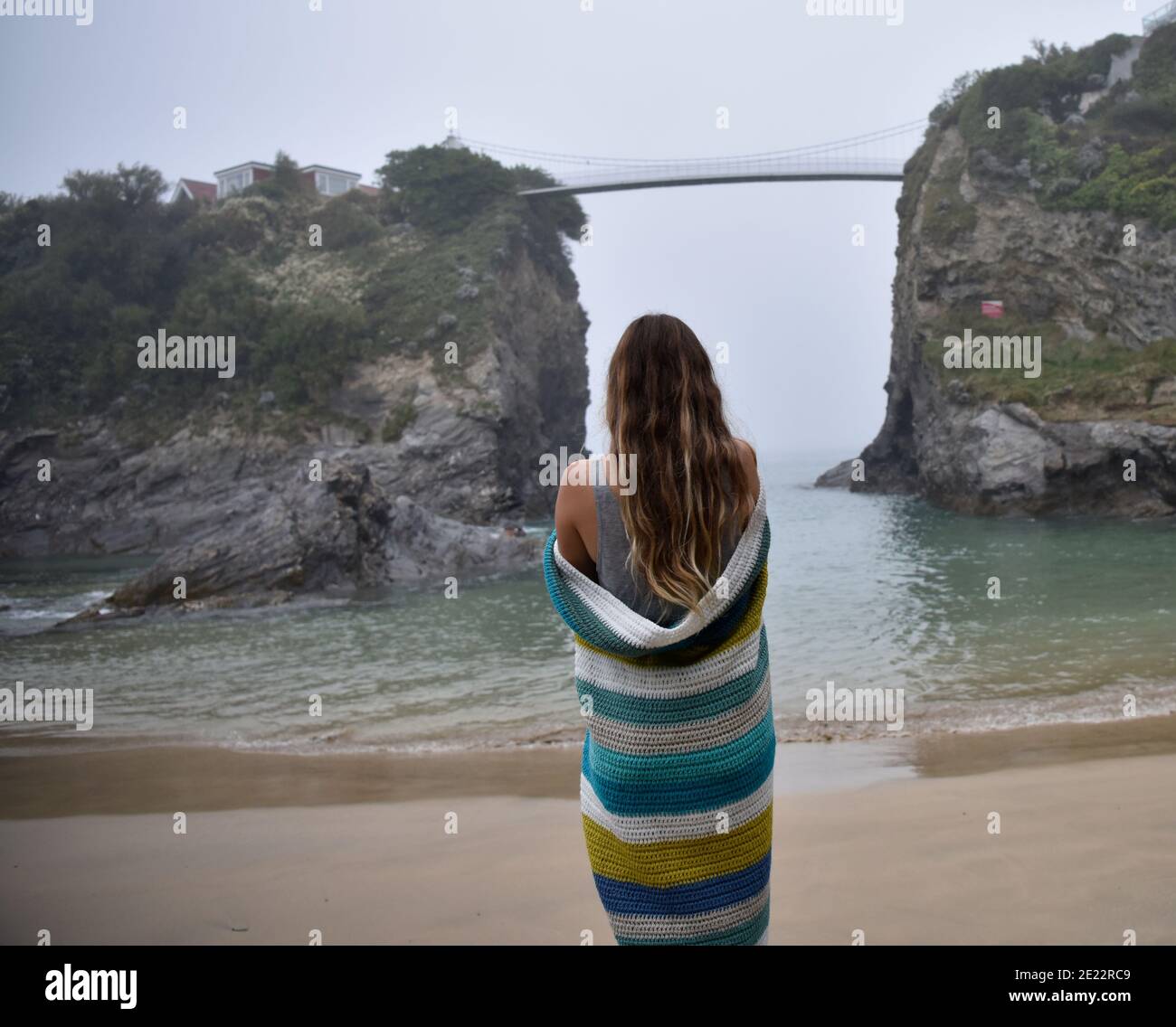Girl on a beach in Cornwall Stock Photo - Alamy
