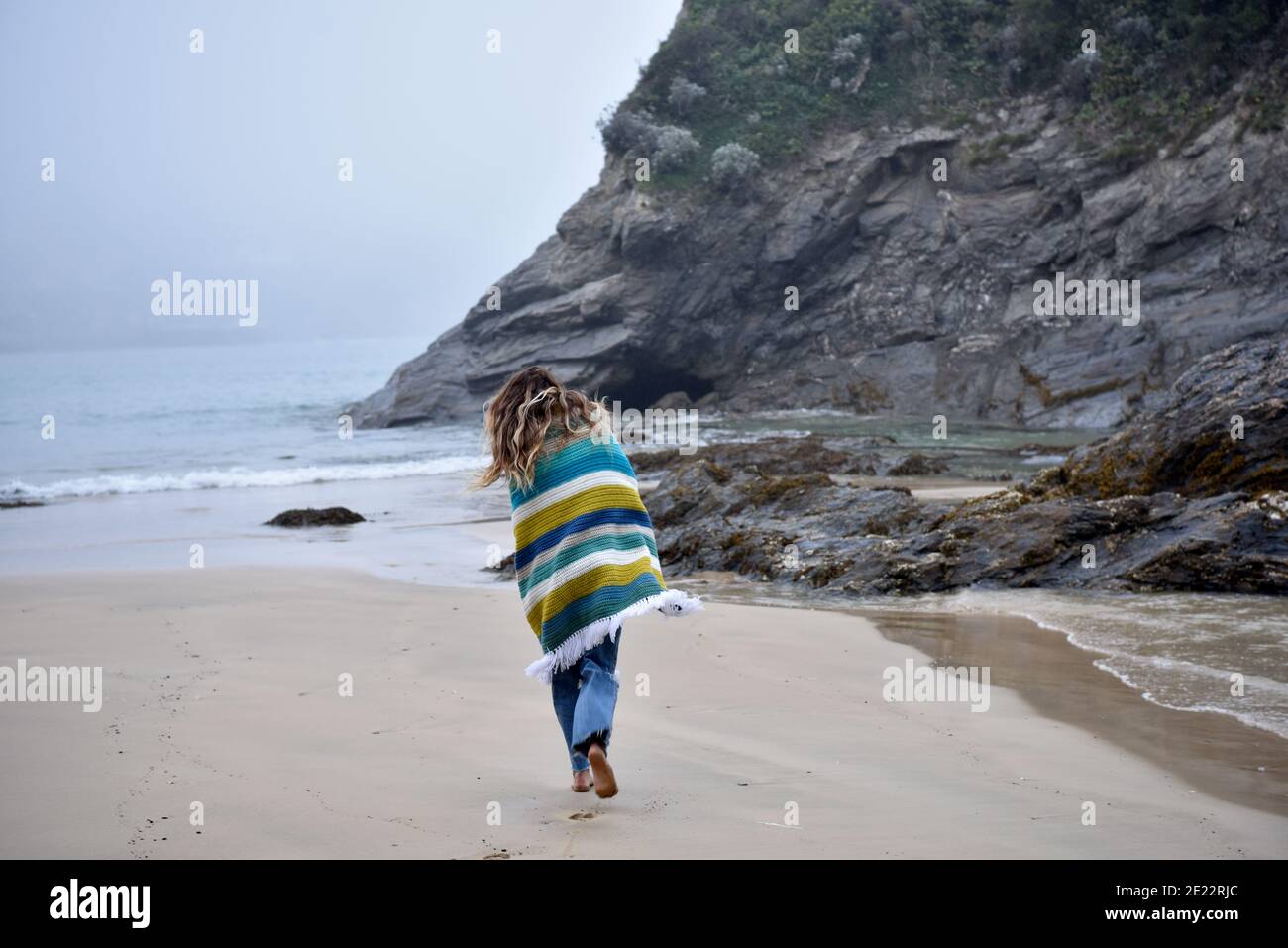 Girl on a beach in Cornwall Stock Photo - Alamy