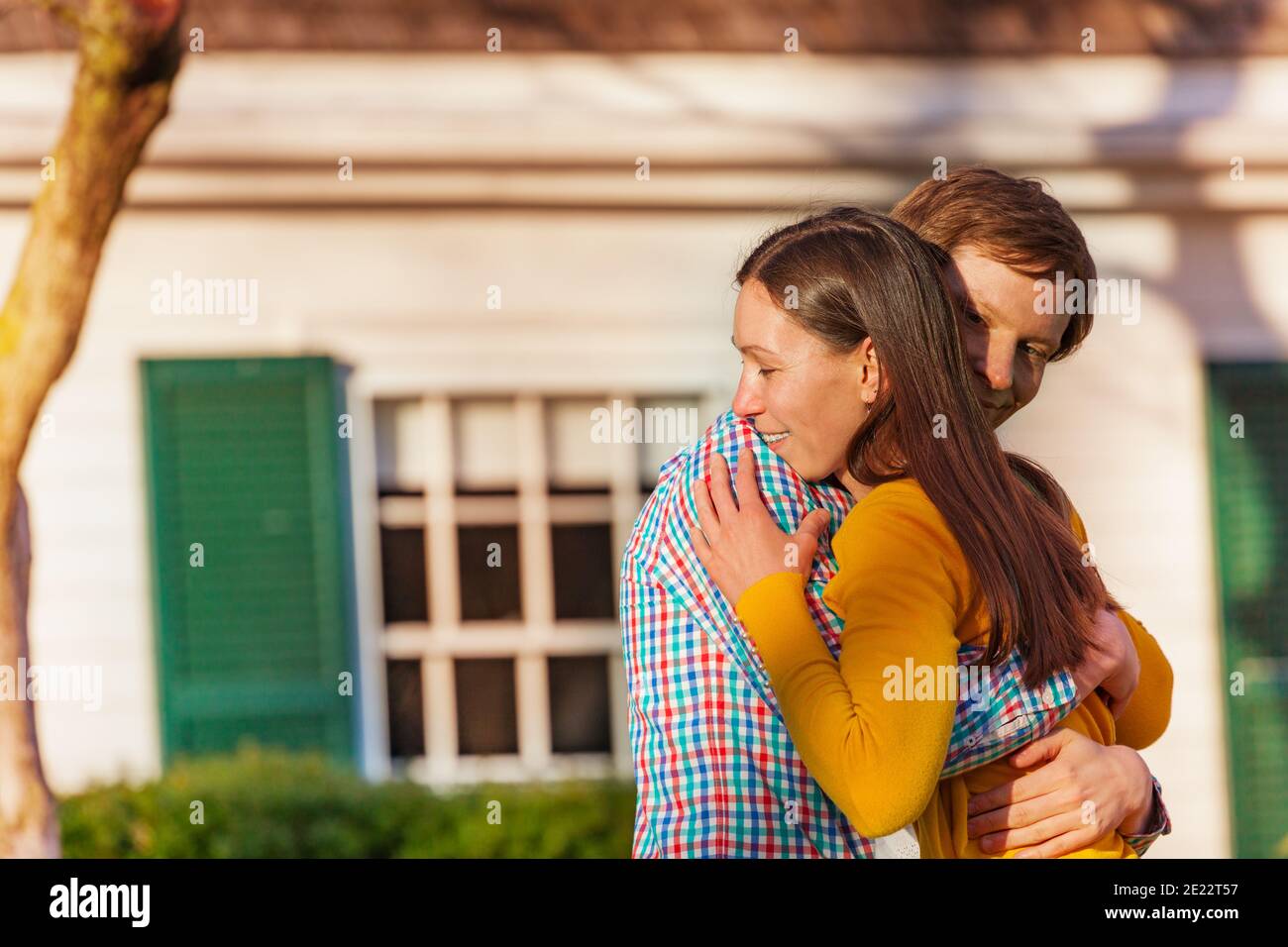 Young lovely couple hug outside in the park close portrait Stock Photo ...