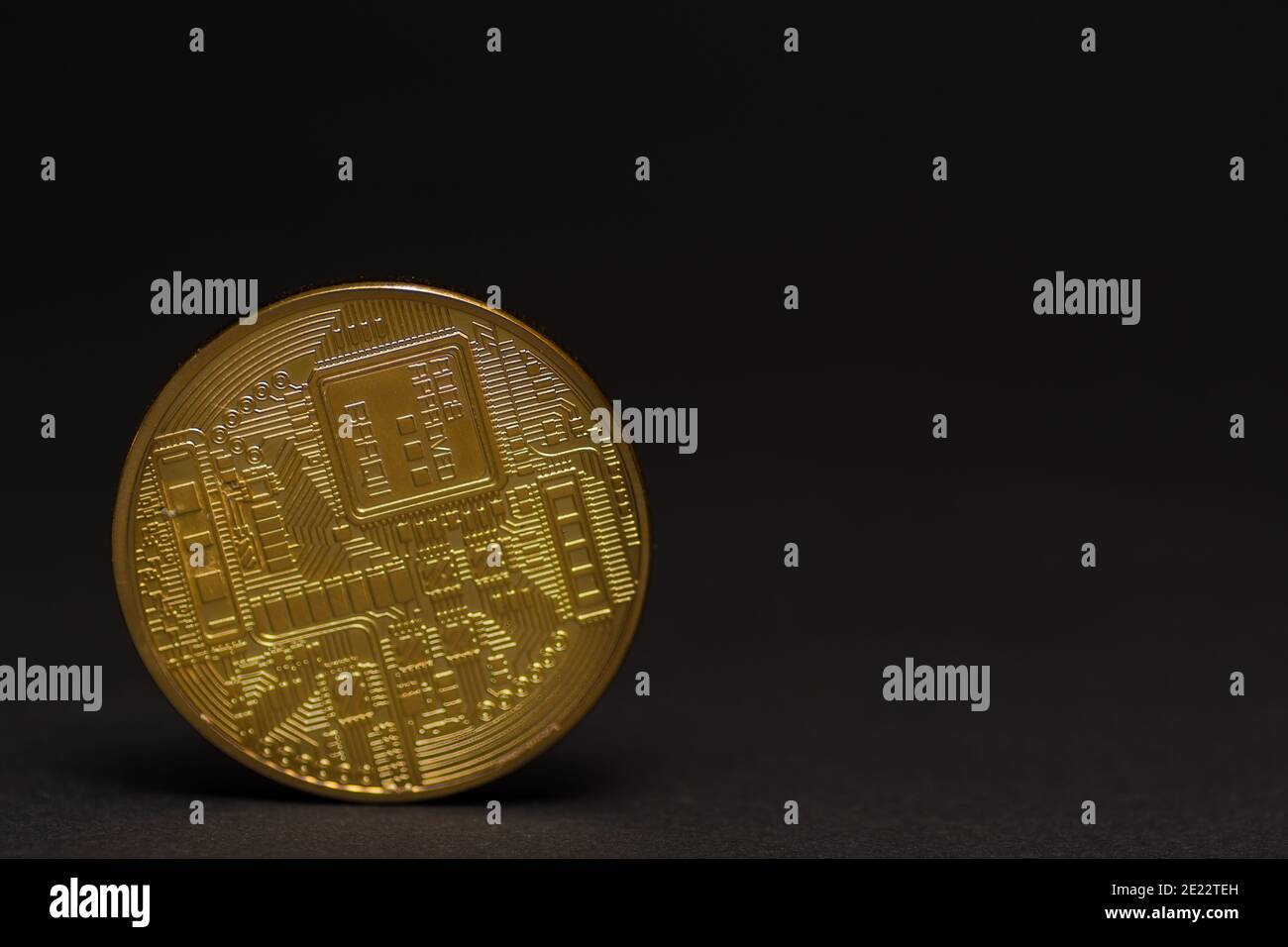 back side from a golden valuable bitcoin with black background left ...