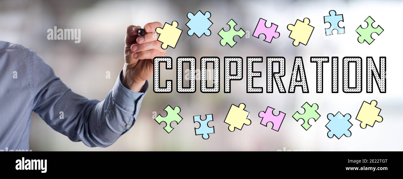 Man drawing a cooperation concept Stock Photo - Alamy