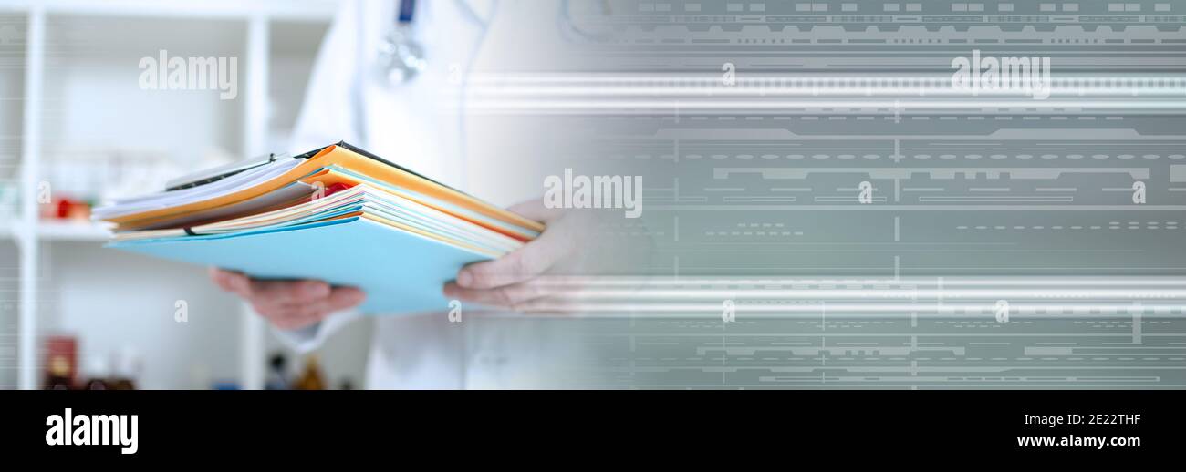 Doctor holding files in his office; panoramic banner Stock Photo - Alamy
