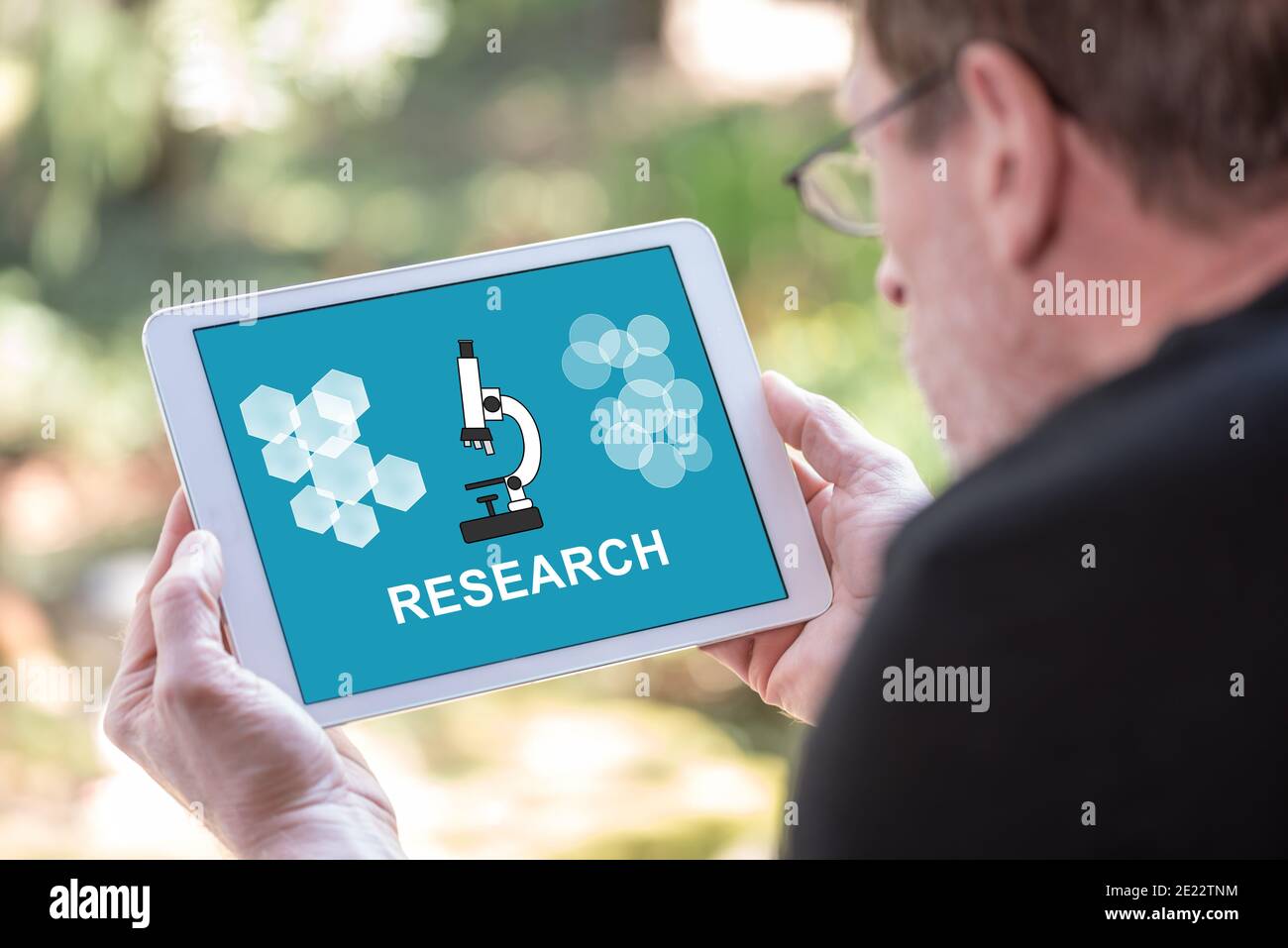 Tablet screen displaying a research concept Stock Photo - Alamy