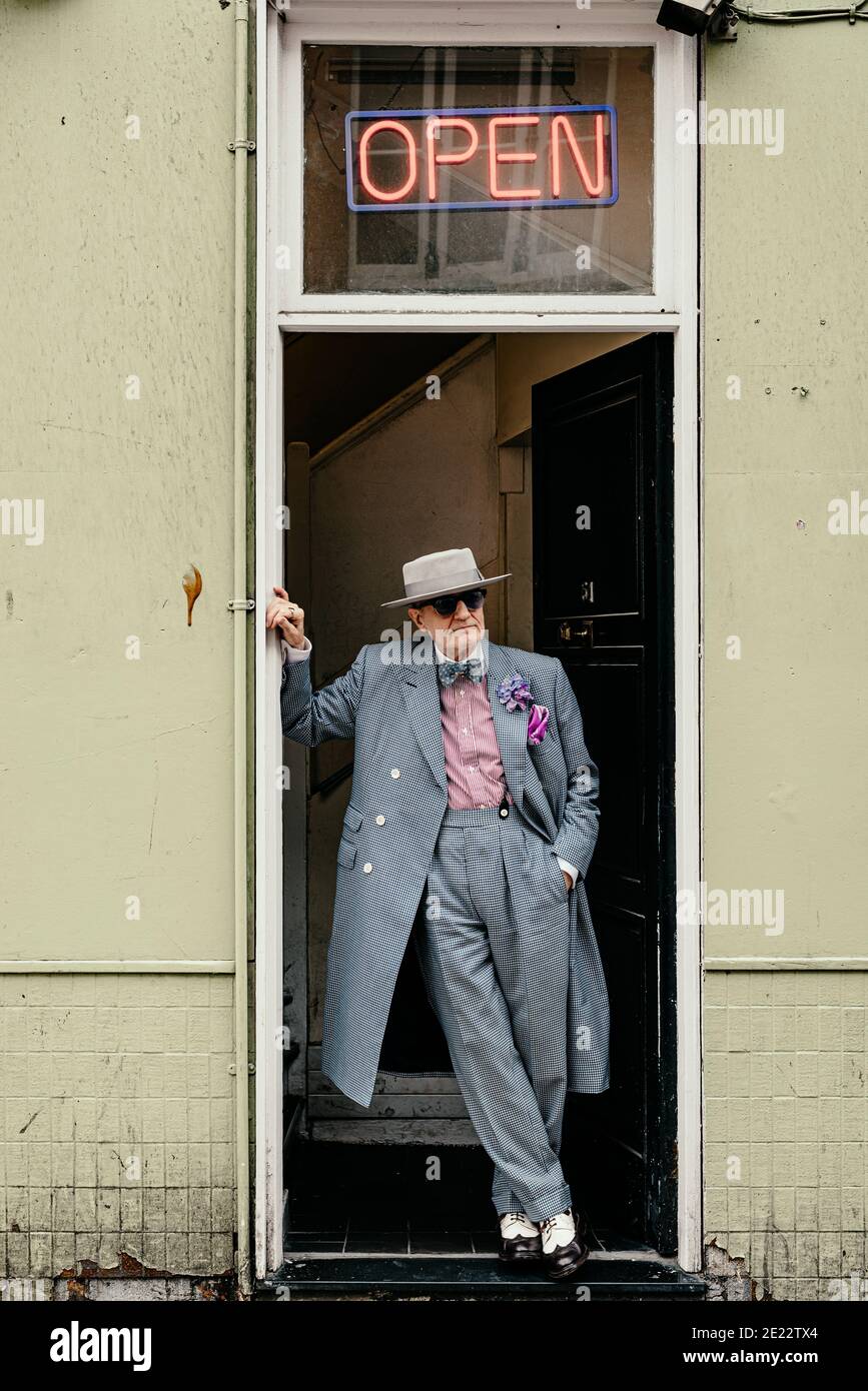 Artist George Skeggs ('Soho George') stands in a doorway on Dean Street ...