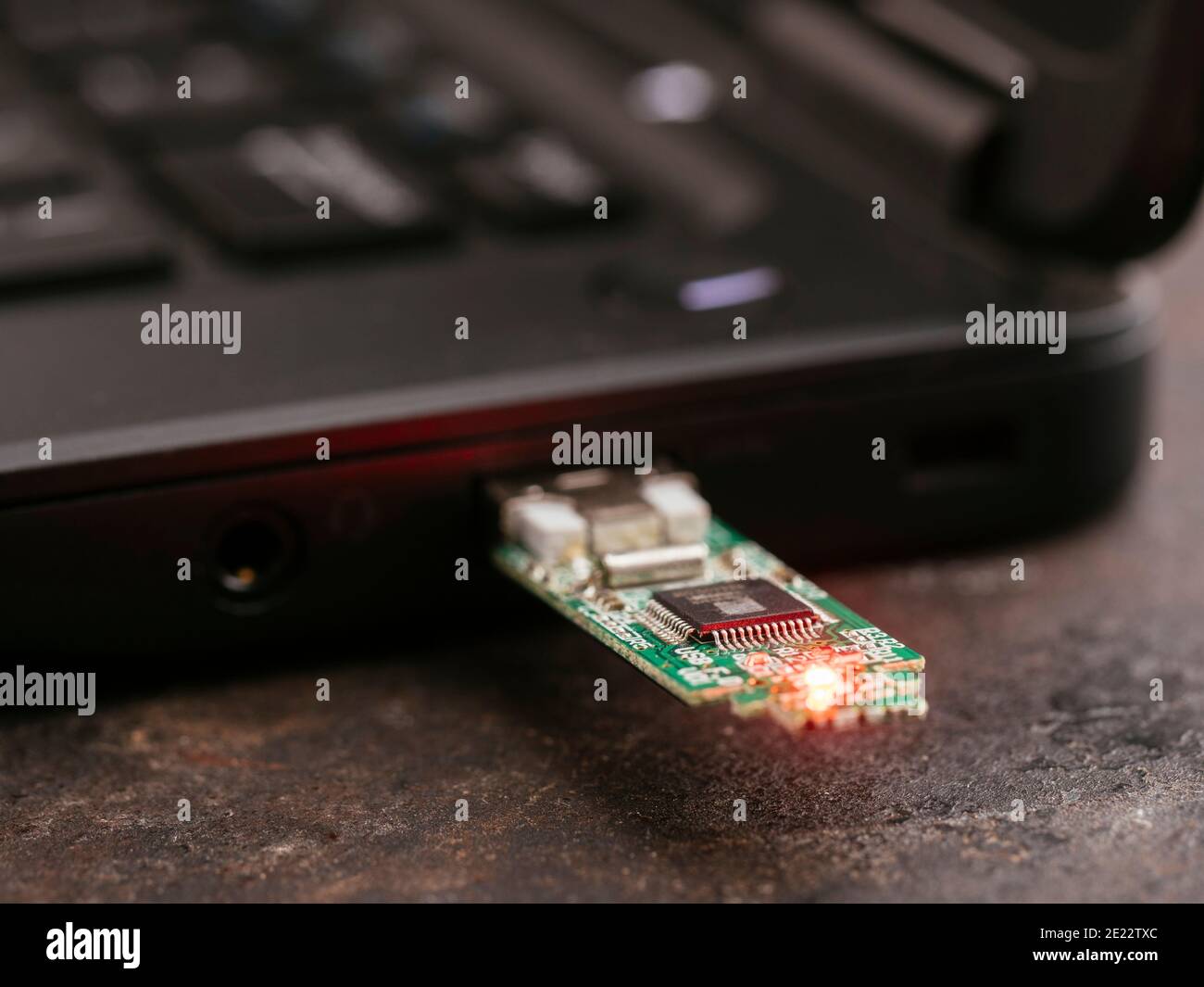 USB stick without case plugged into a black laptop computer Stock Photo ...