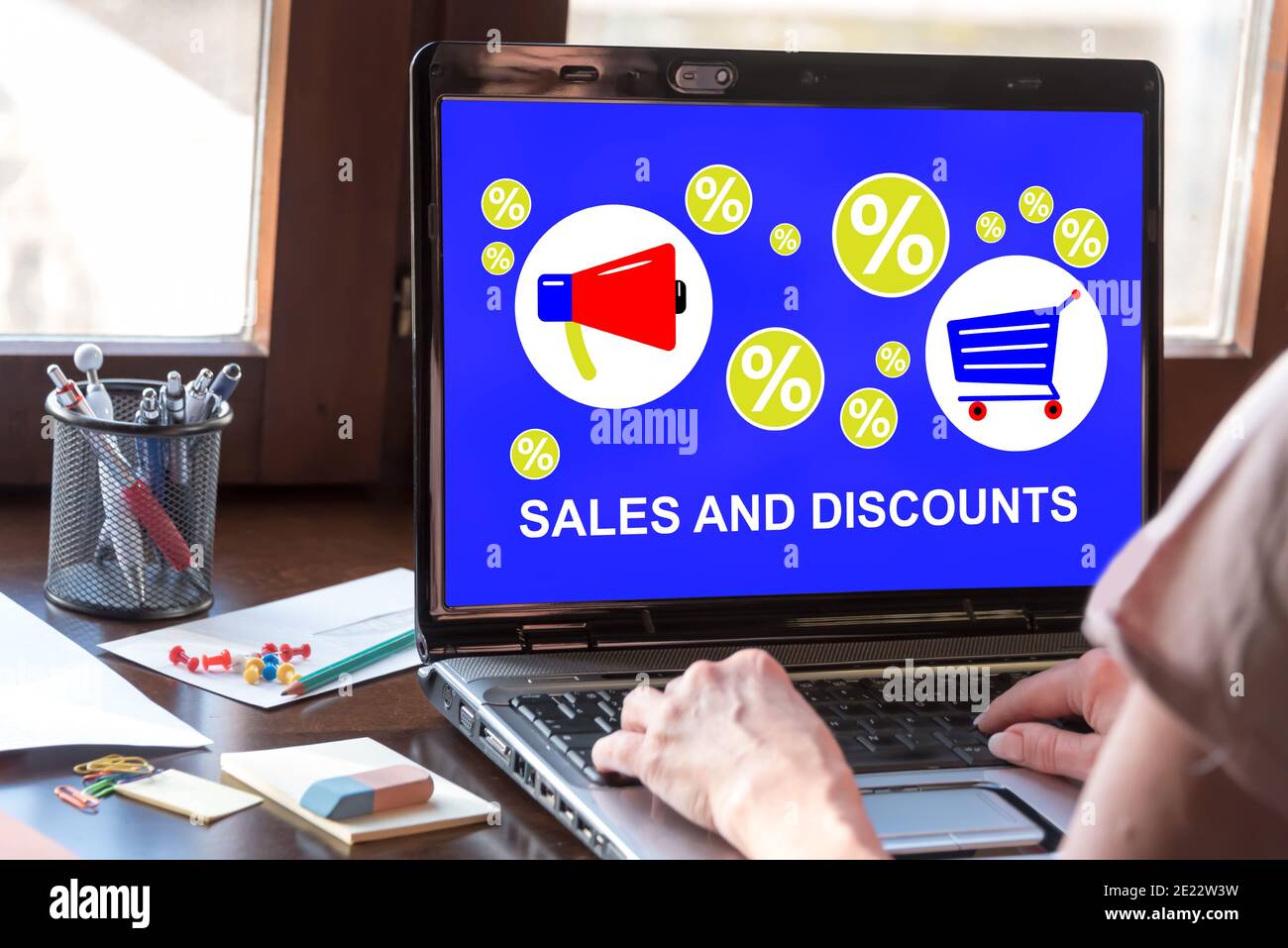 Laptop screen displaying a sales and discounts concept Stock Photo - Alamy