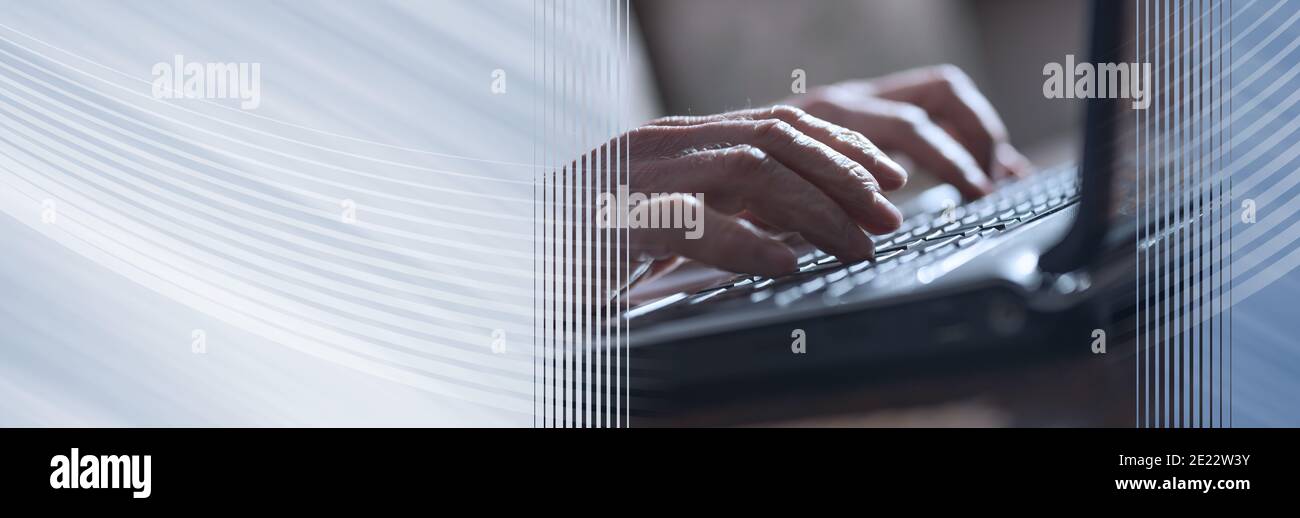 Hands typing on a laptop, hard light effect. panoramic banner Stock ...
