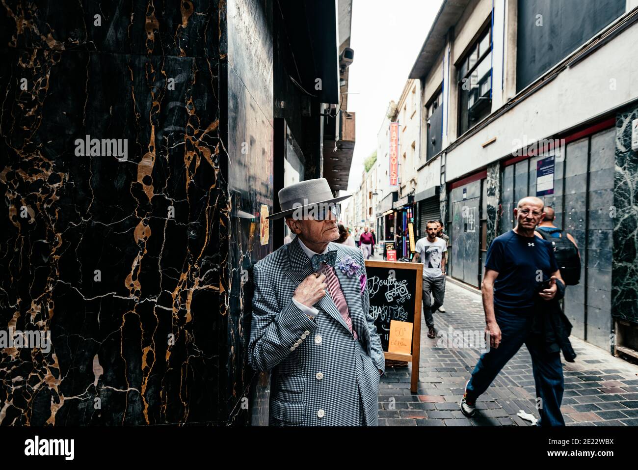 Artist George Skeggs ('Soho George') stands in Walker's Court, an ...