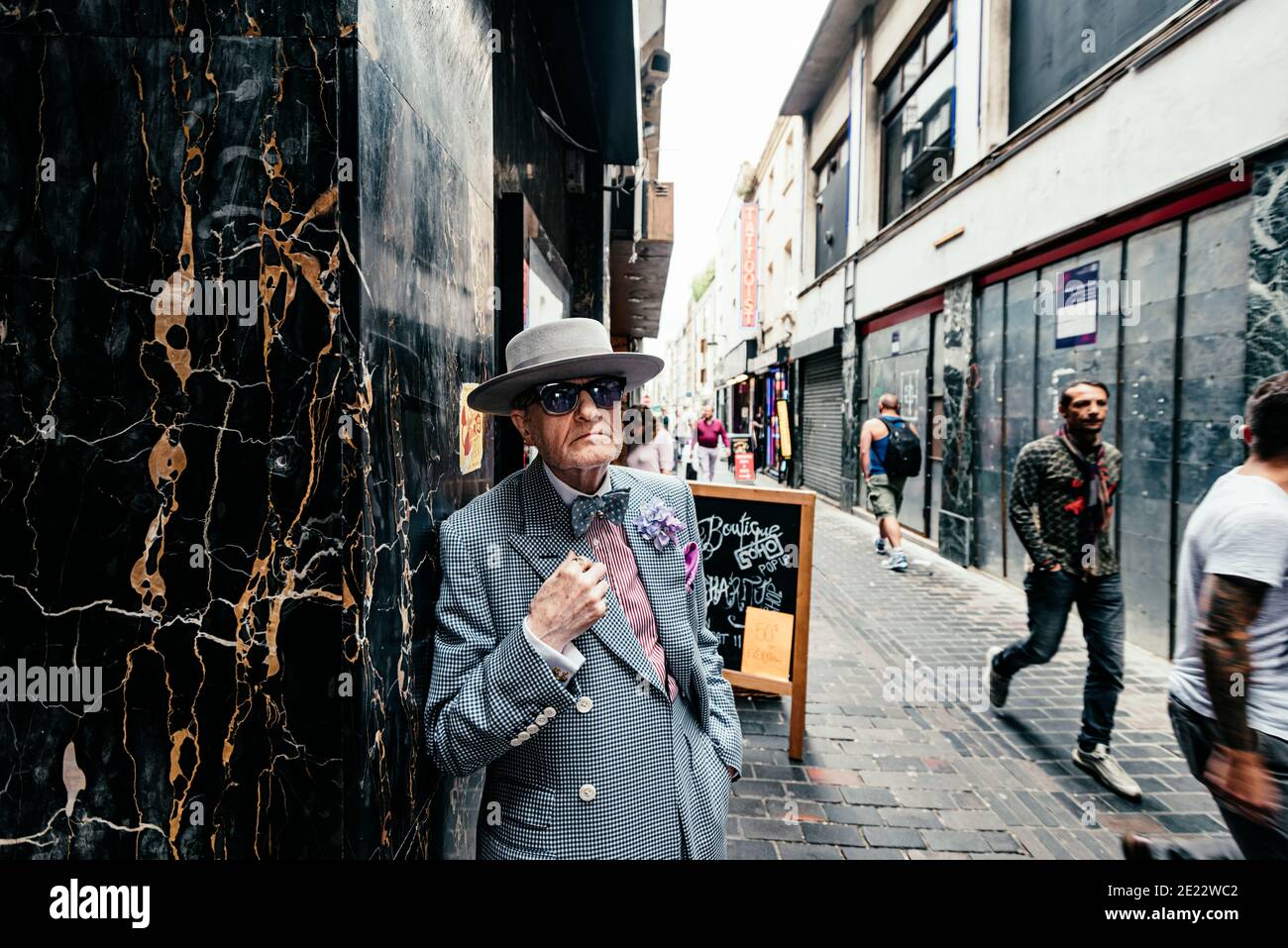 Artist George Skeggs ('Soho George') stands in Walker's Court, an ...
