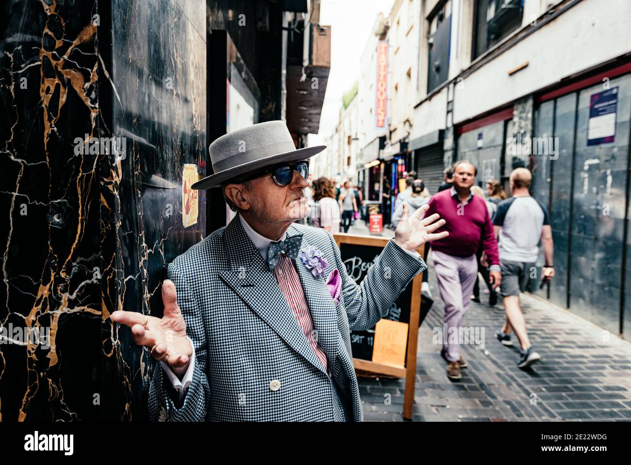 Artist George Skeggs ('Soho George') stands in Walker's Court, an ...