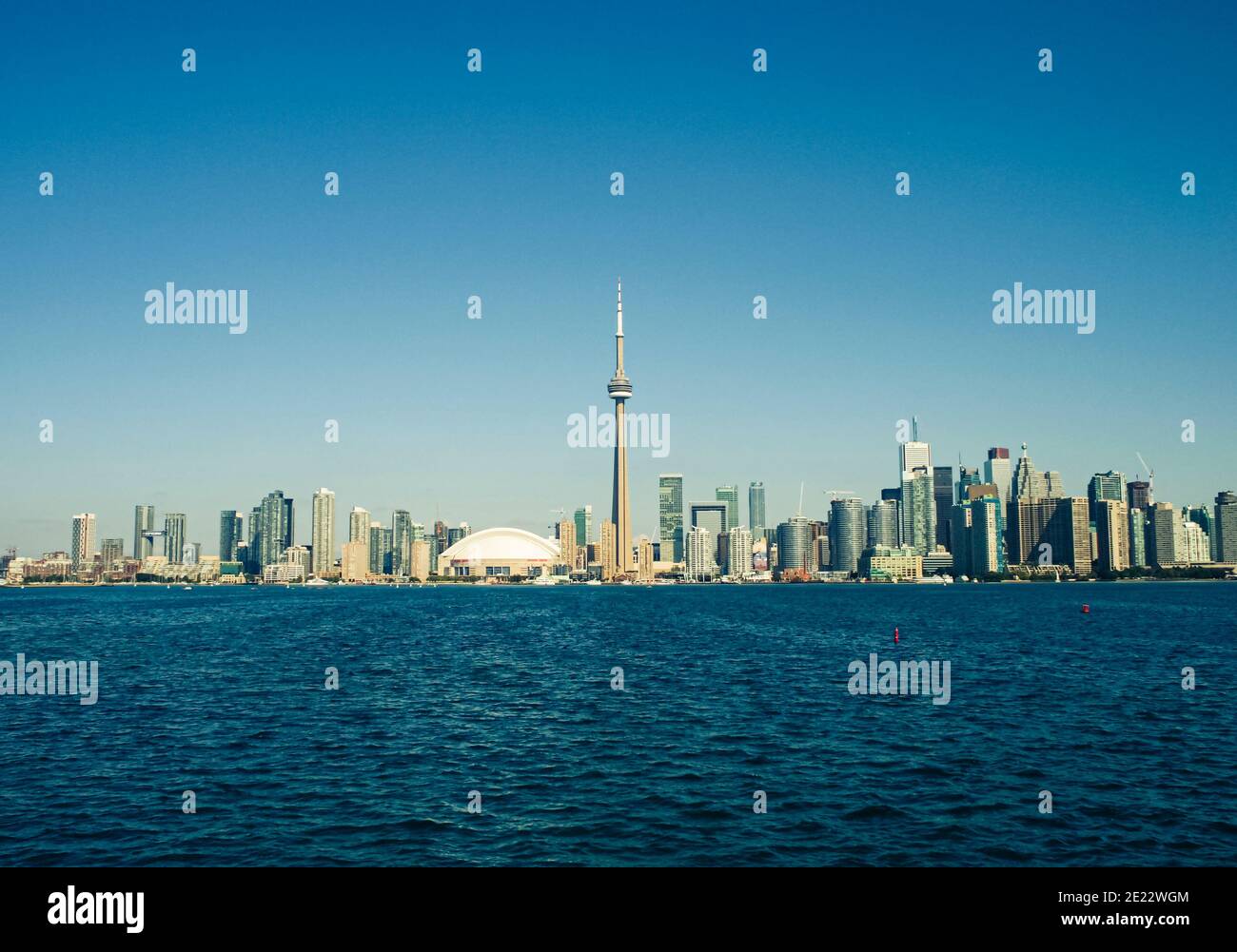 Downtown Toronto skyline by the harbour with CN Tower and Rogers Centre ...
