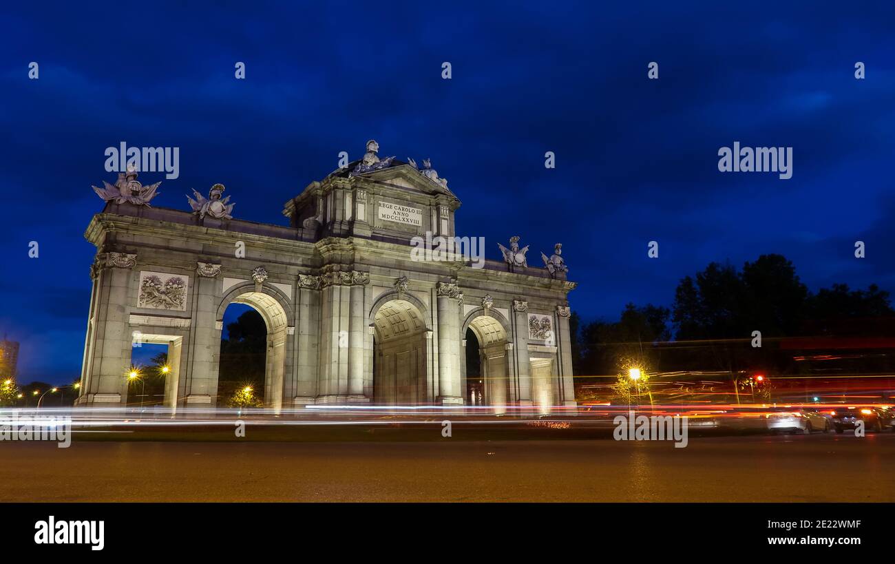 Puerta de Alcala (Alcala Gate) at night with cars in Madrid Stock Photo ...