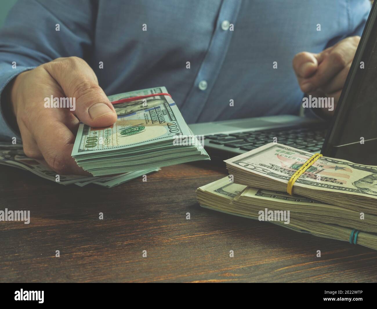 Payday cash loan online concept. Man with laptop offers money Stock ...