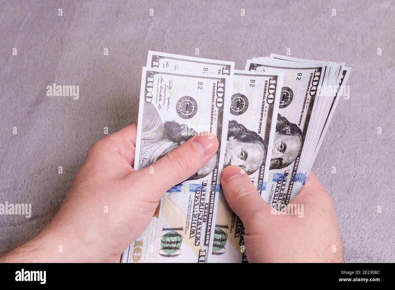 Hands counting stack money on hi-res stock photography and images - Alamy