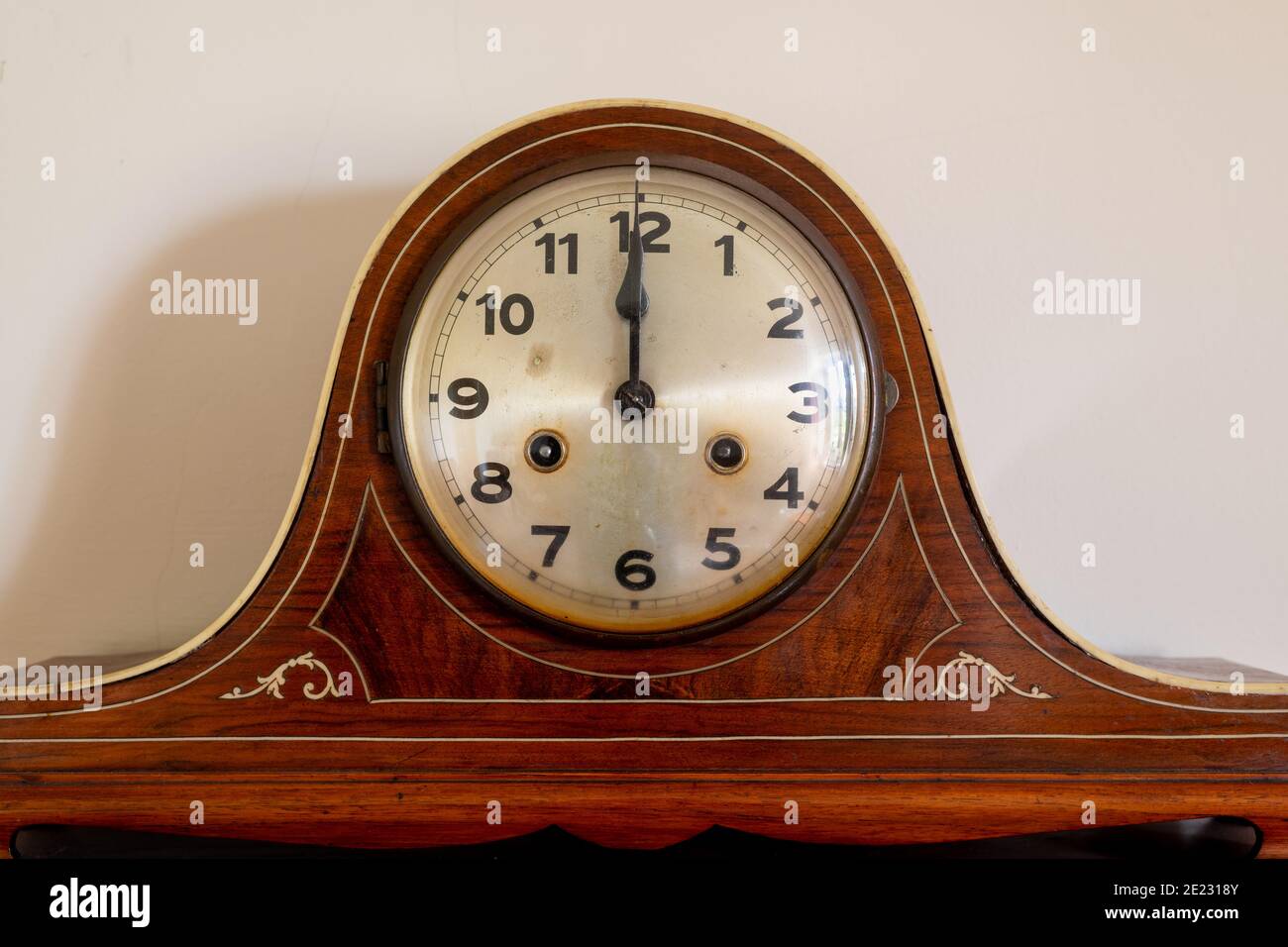 Close up of an antique clock showing 12 oclock Stock Photo - Alamy
