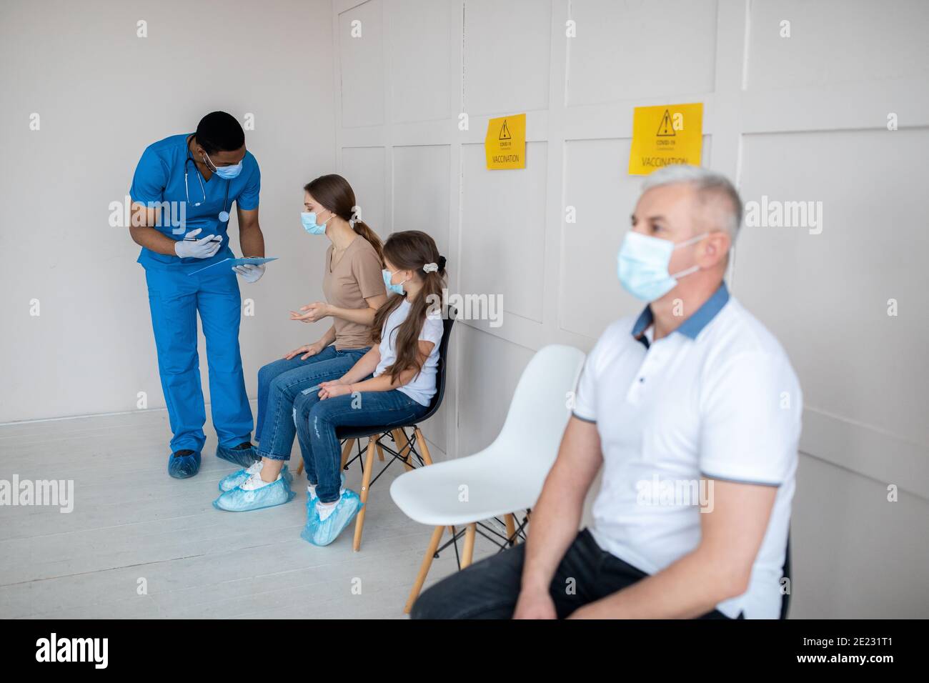 Immunization against coronavirus. Senior man in medical mask waiting ...