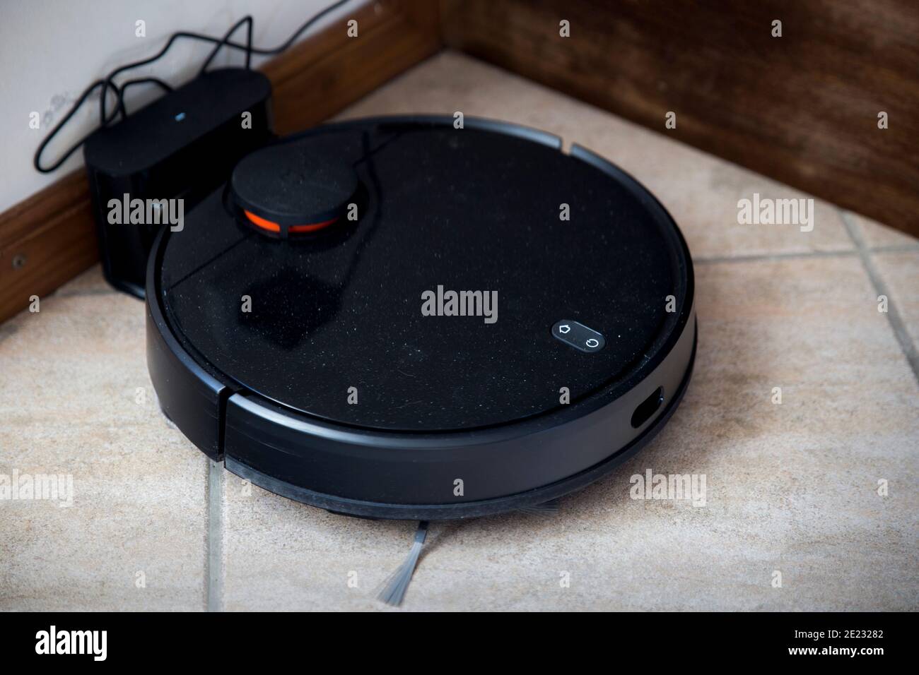 Side view of Robot vacuum cleaner on the floor, intelligent robotic ...