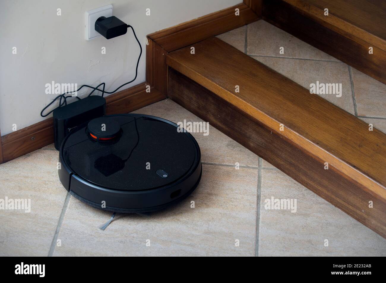 Side view of Robot vacuum cleaner on the floor, intelligent robotic ...