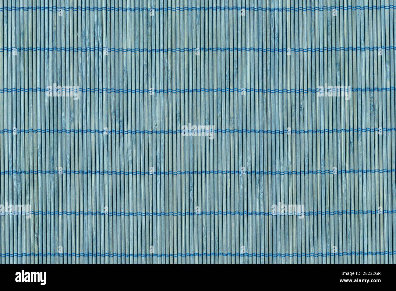 Macro shot of a blue bamboo food mat isolated on a white background ...