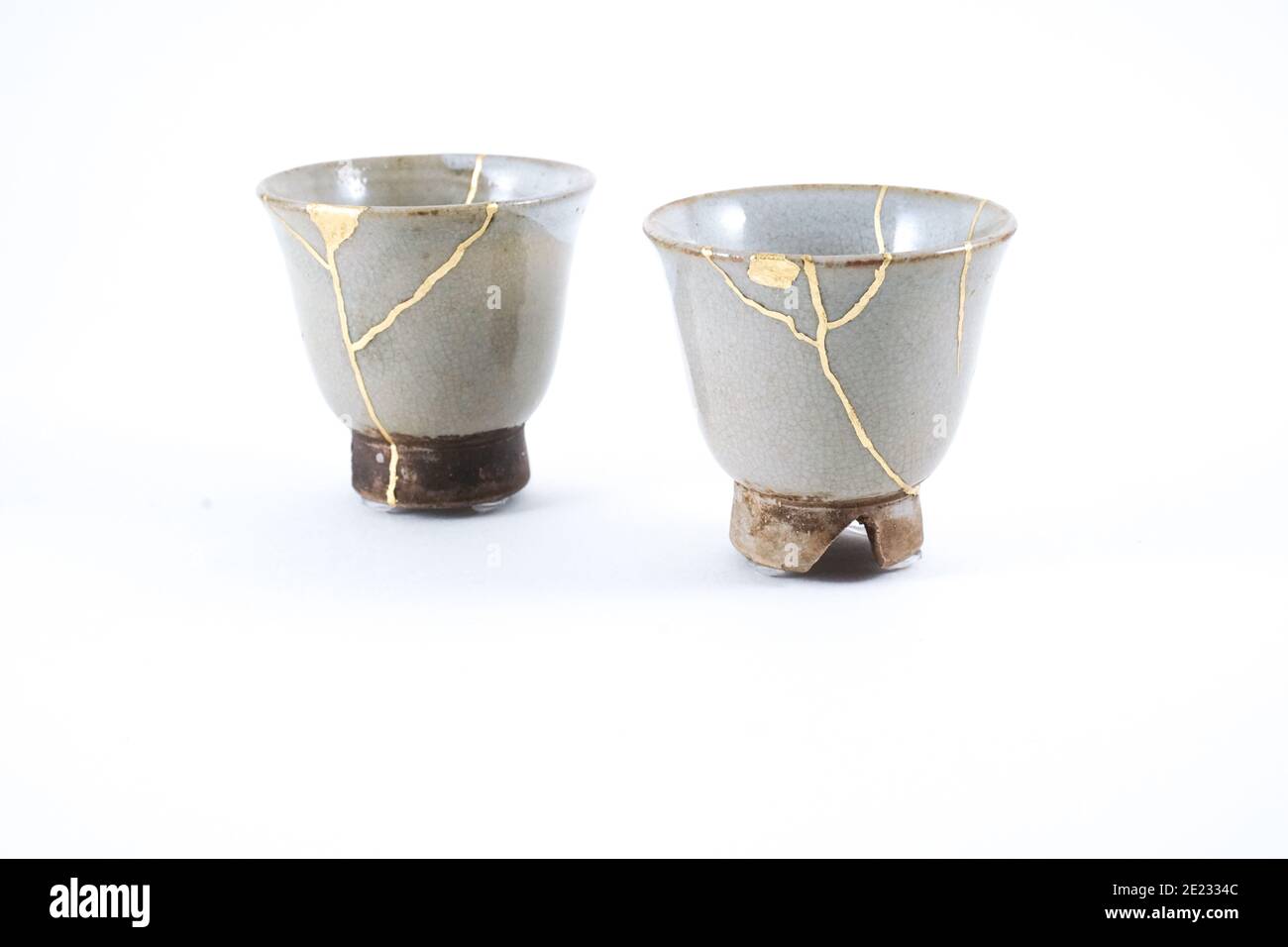 Beige Kintsugi Japanese sake cups isolated Stock Photo - Alamy